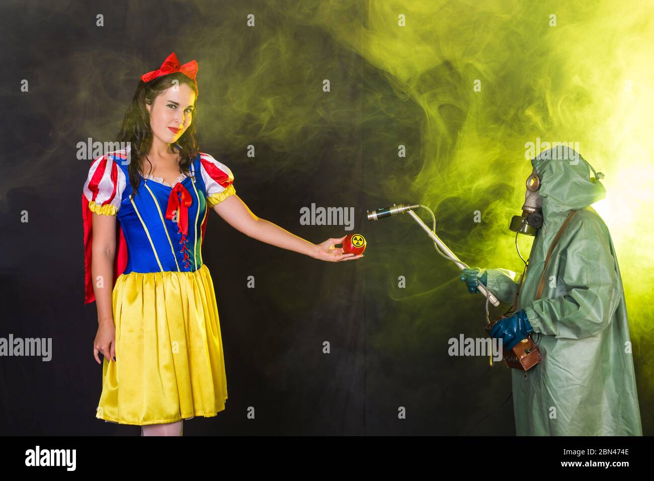 Woman holding hazardous radioactive apple. Nuclear and radiation ...