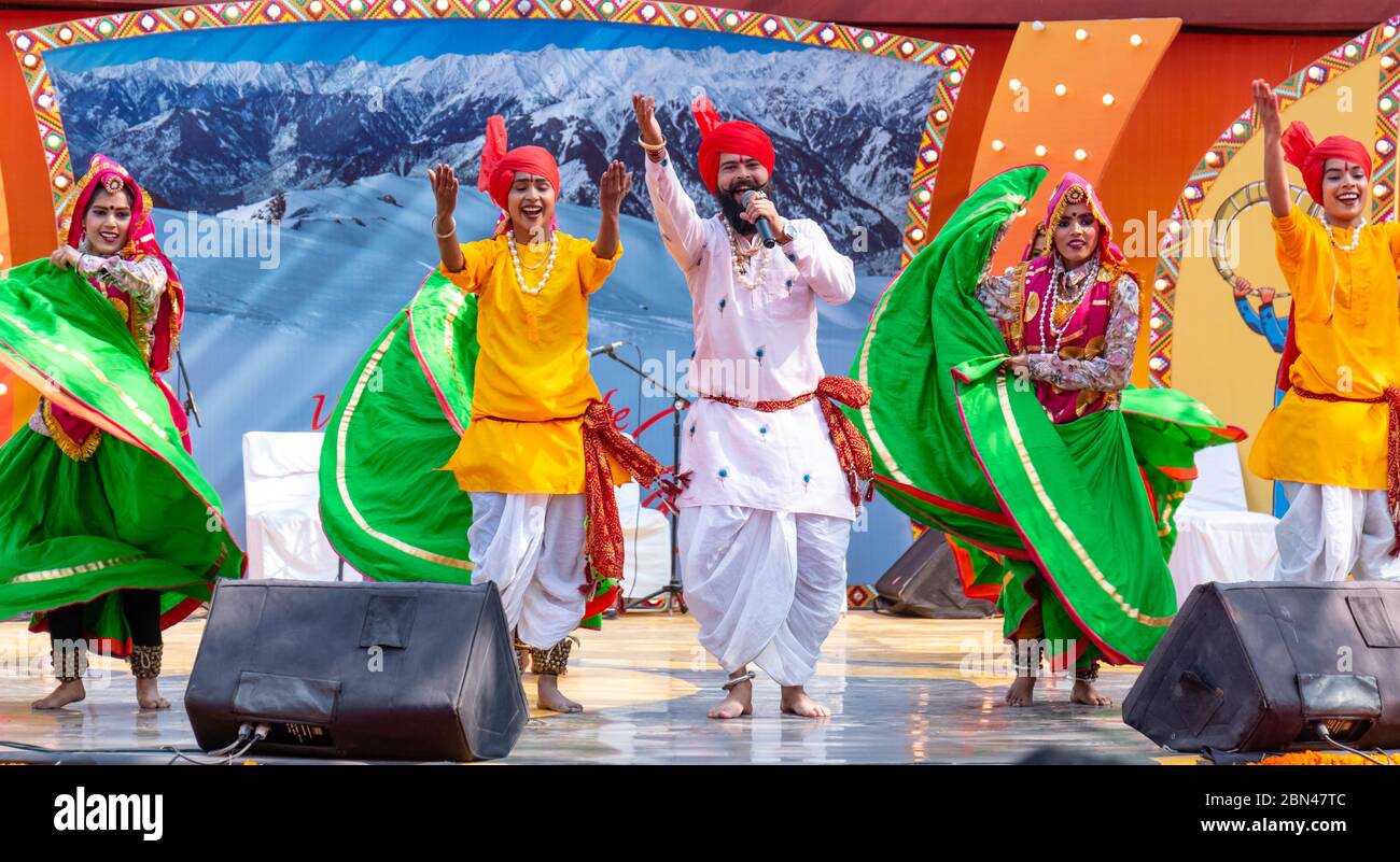 Young Indian Male and Female dancers performing regional/folk dance in ...