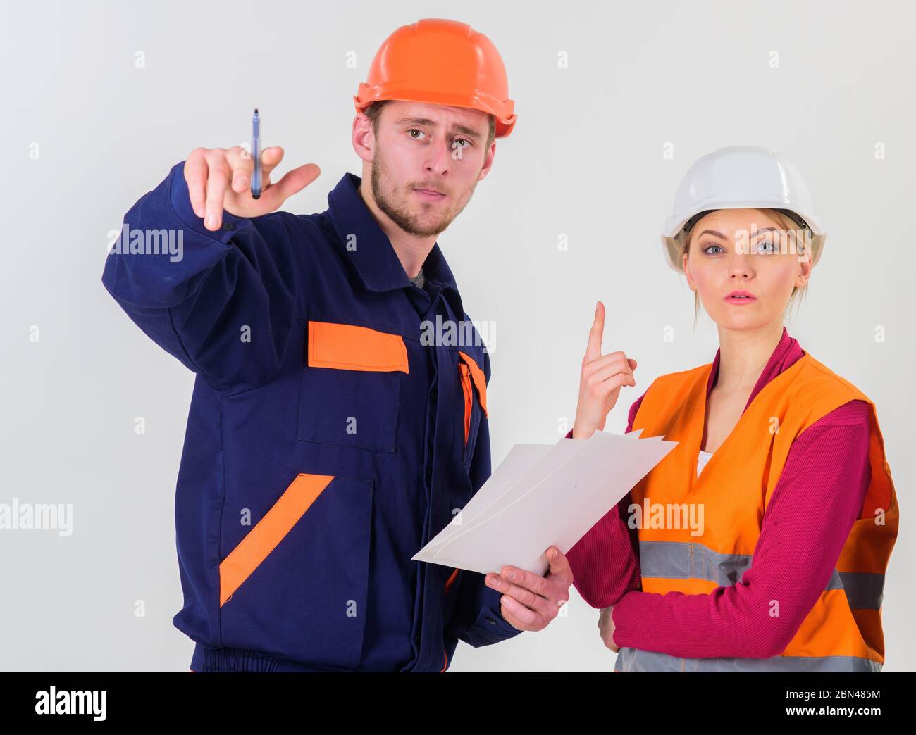 Architect and engineer with document, isolated white background ...