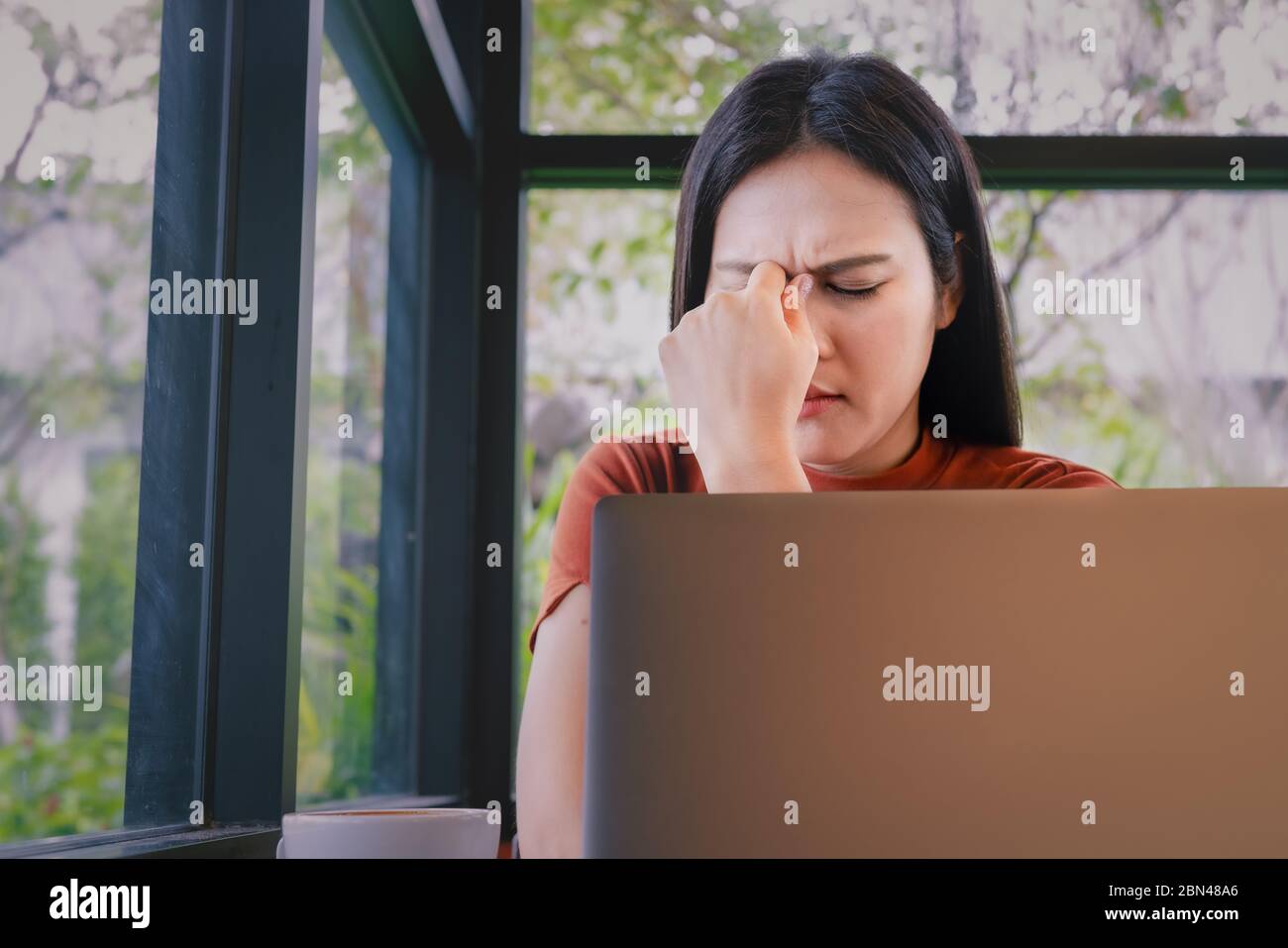 stressed businesswoman headache working on laptop computer. Negative ...