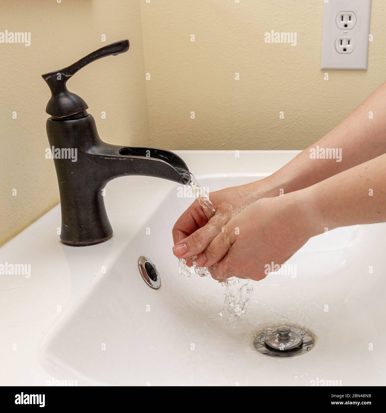 Closeup of Washing Hands with Vintage Bronze Faucet Stock Photo - Alamy