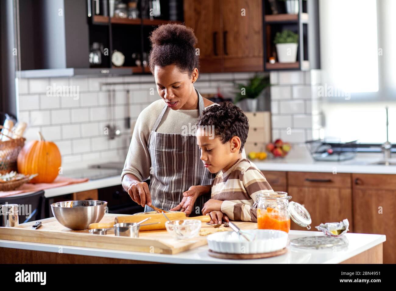 Mum and his son cook in the kitchen Stock Photo - Alamy