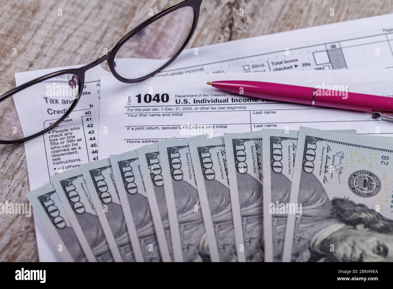 2020 tax return form 1040 with calculator and focus through glasses ...