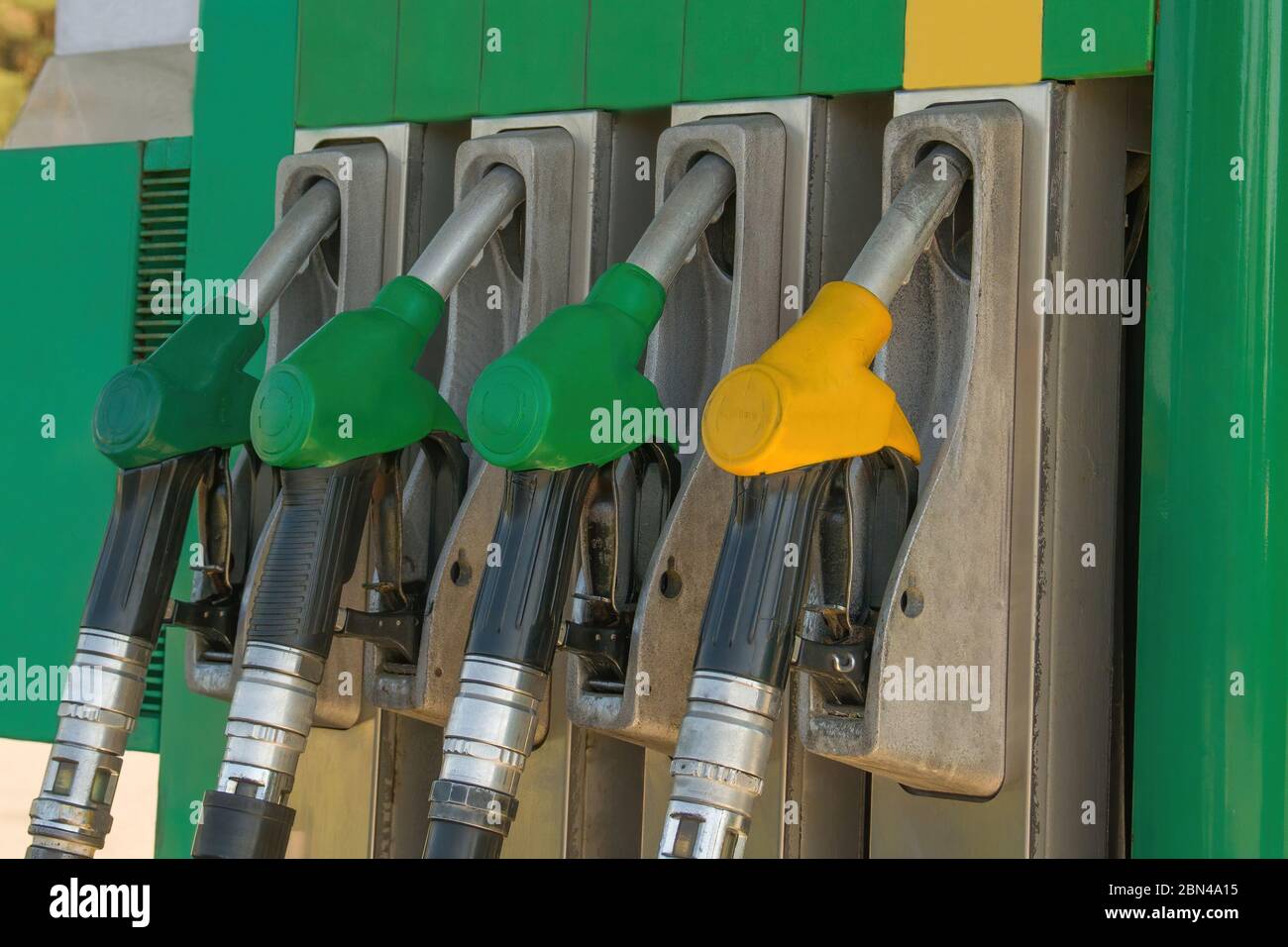 Pump nozzles at the gas fuel station. Gasoline dispenser on petrol ...