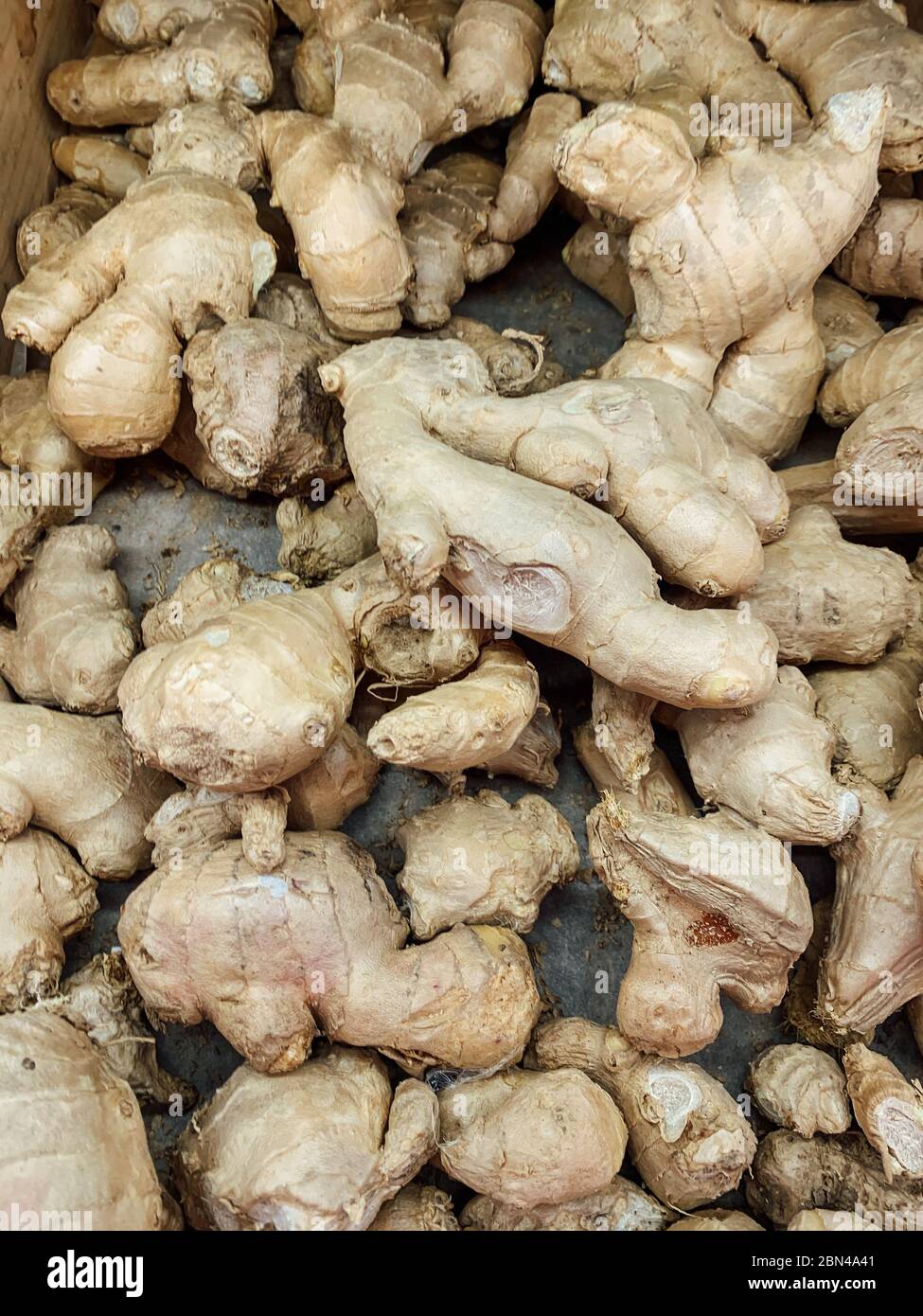 useful ginger root for eating as a background Stock Photo - Alamy