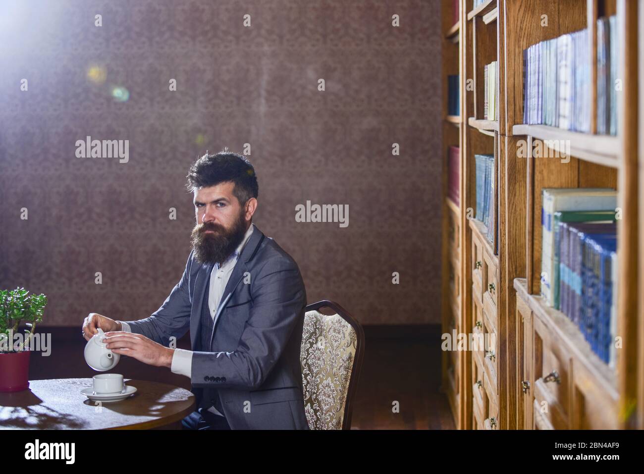 Aristocratic traditions concept. Aristocrat on strict face having tea ...