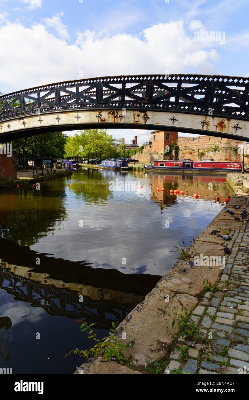 Steel bridge over the Bridgewater Canal with blue sky and white cloud ...