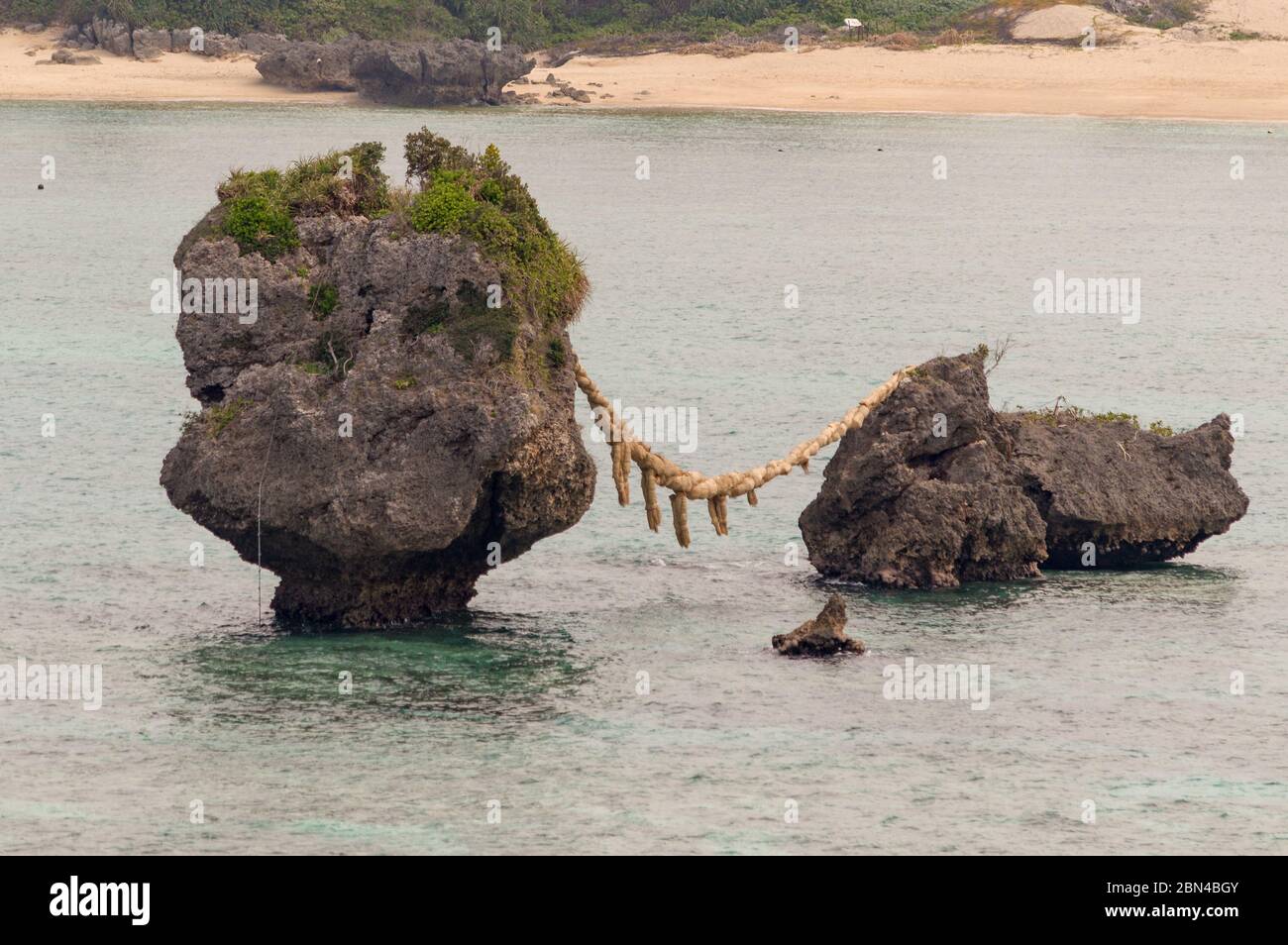 Blue sea and volcanic rock formations on the coast of Okinawa island in ...