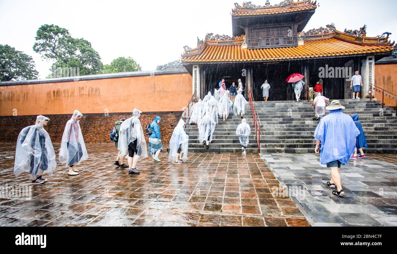 Hue-Vietnam-0002Oct152019 Visitors in rain covering brave the pouring ...