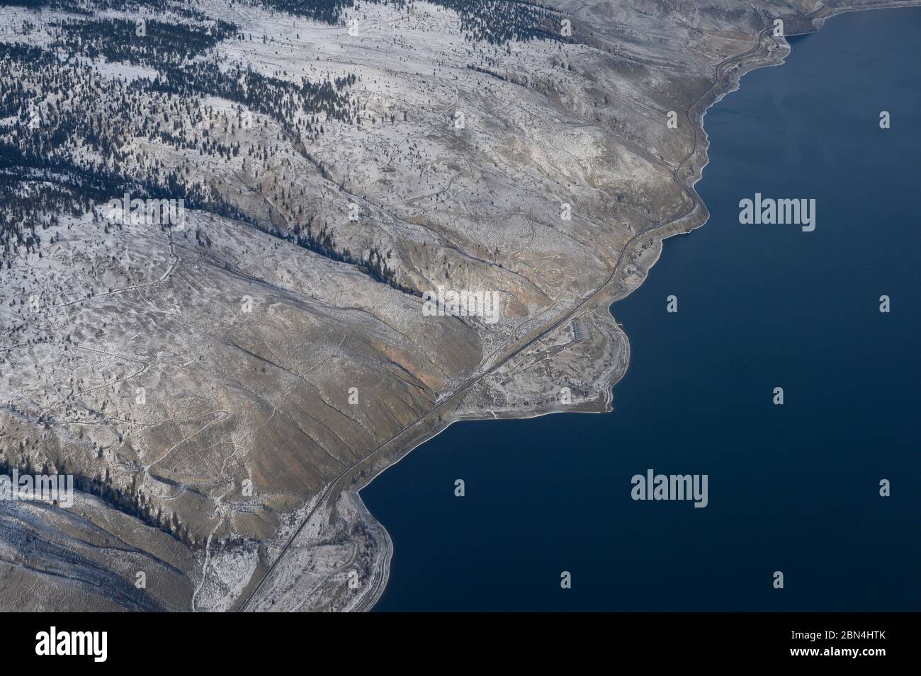 Elevated view of shoreline along mountain range, Sun Peaks Resort, Sun ...