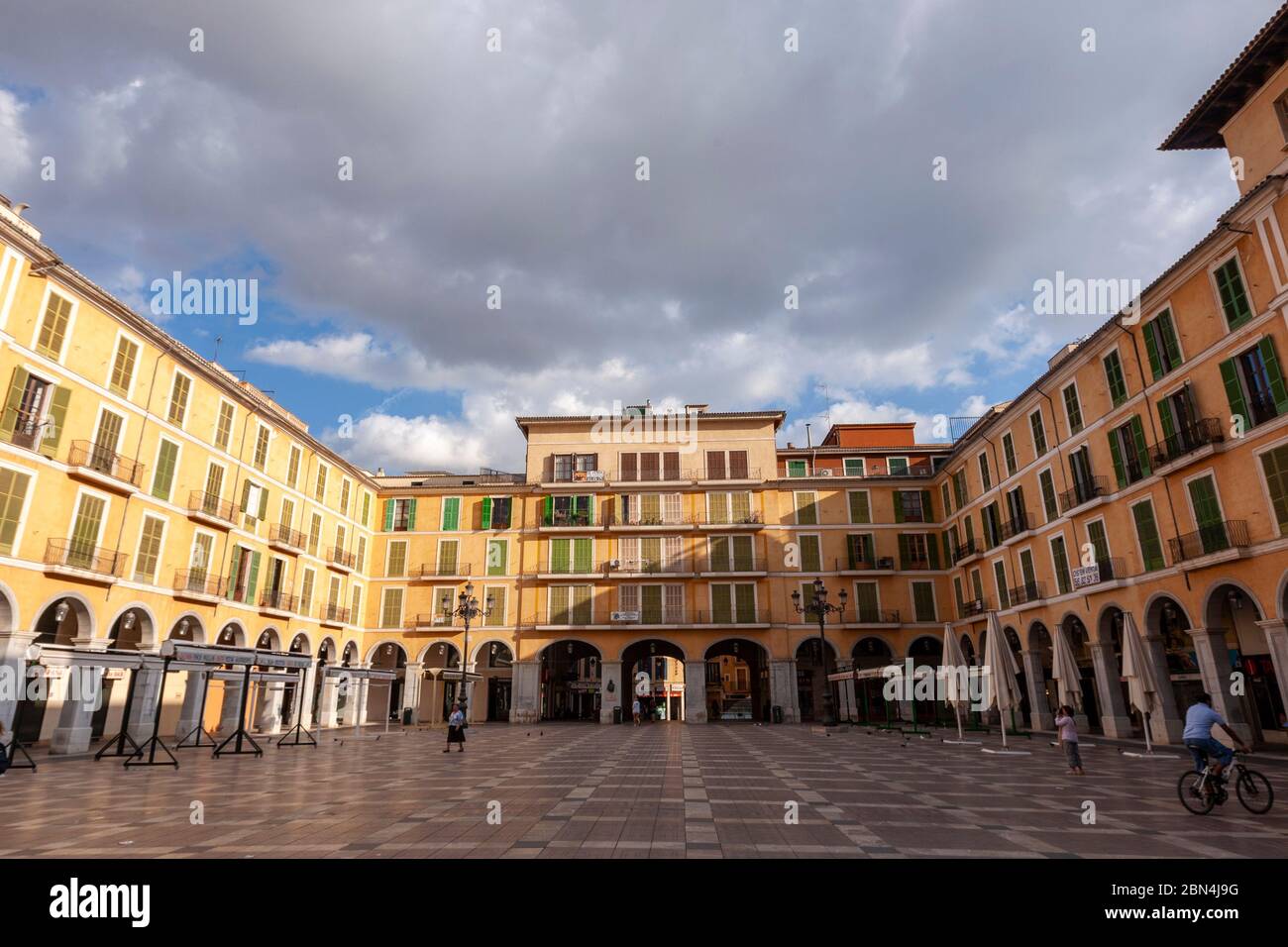 People in bar terraces in Plaça d'En Coll, Palma de Mallorca, Balearic ...
