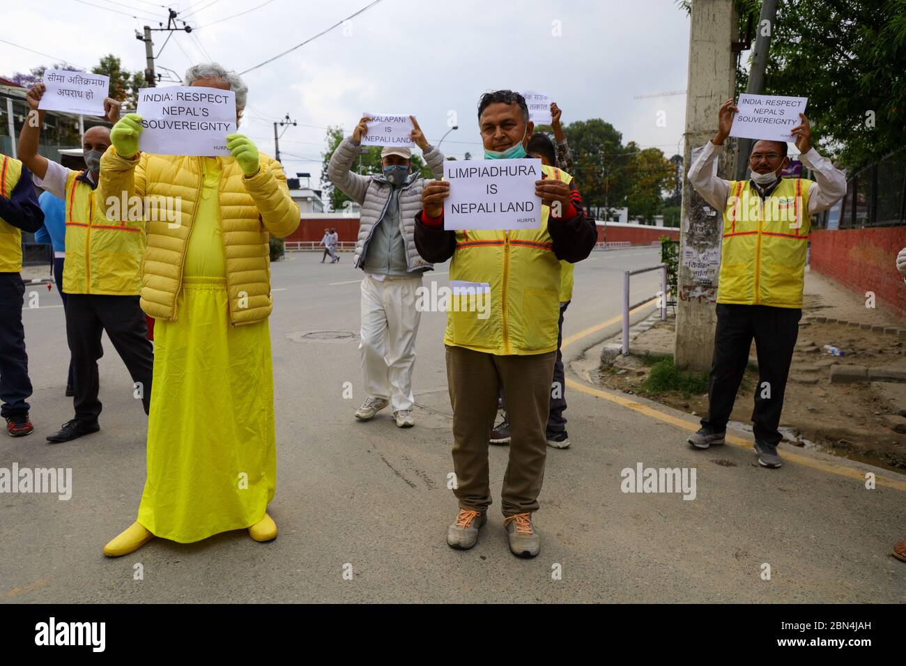 Kathmandu, Nepal. 12th May, 2020. Human Rights Activists hold playcard ...