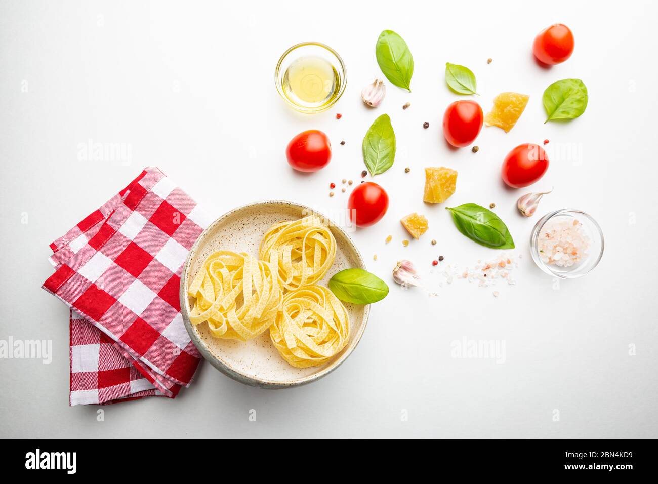 Pasta background. Several types of dry pasta with vegetables and herbs ...