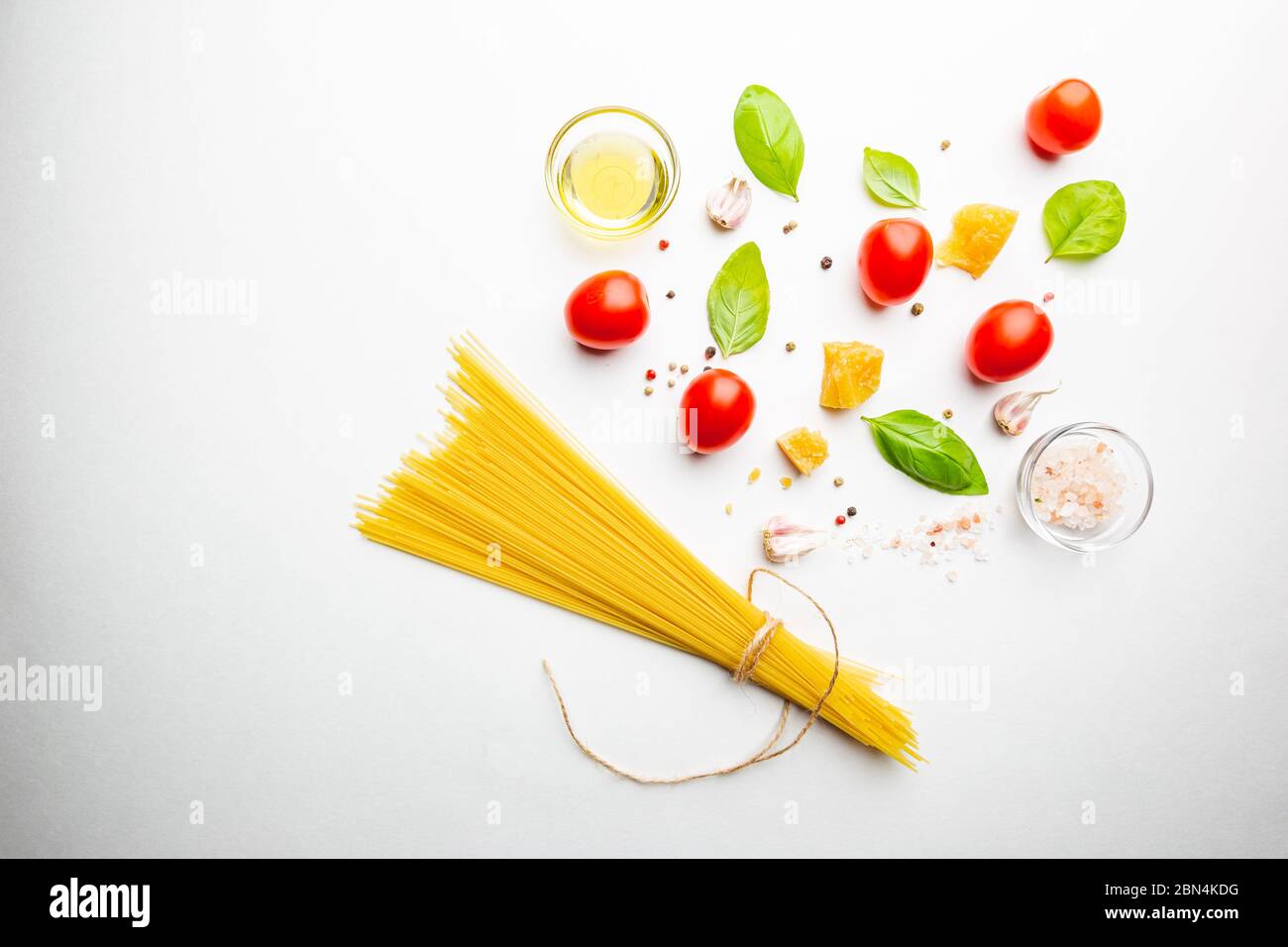 Pasta background. Several types of dry pasta with vegetables and herbs ...