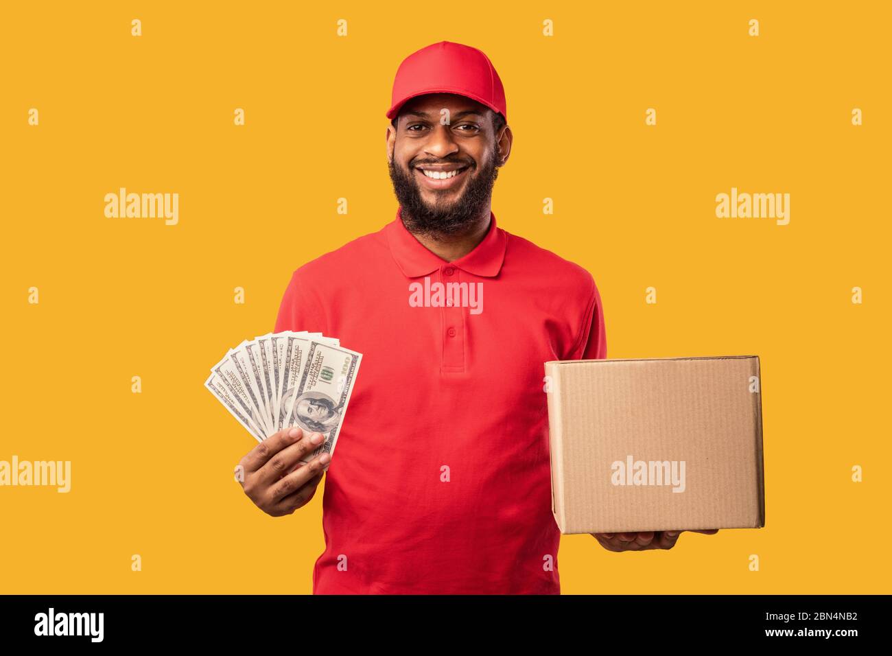 Courier Man Holding Money And Parcel Box On Yellow Background Stock ...
