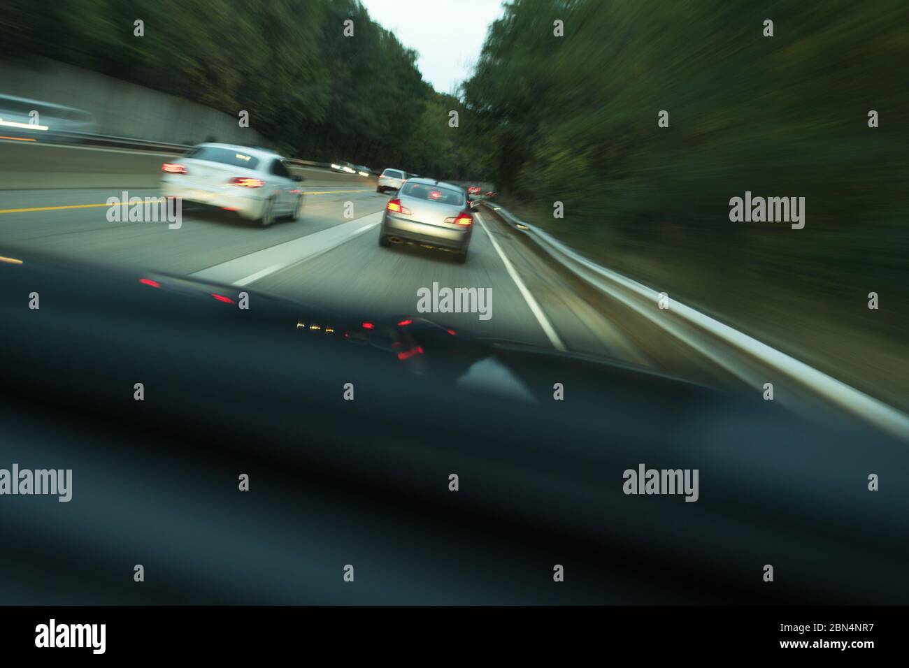 Car Dashboard View Of Highway Commute And Many Speeding Vehicles On Two ...
