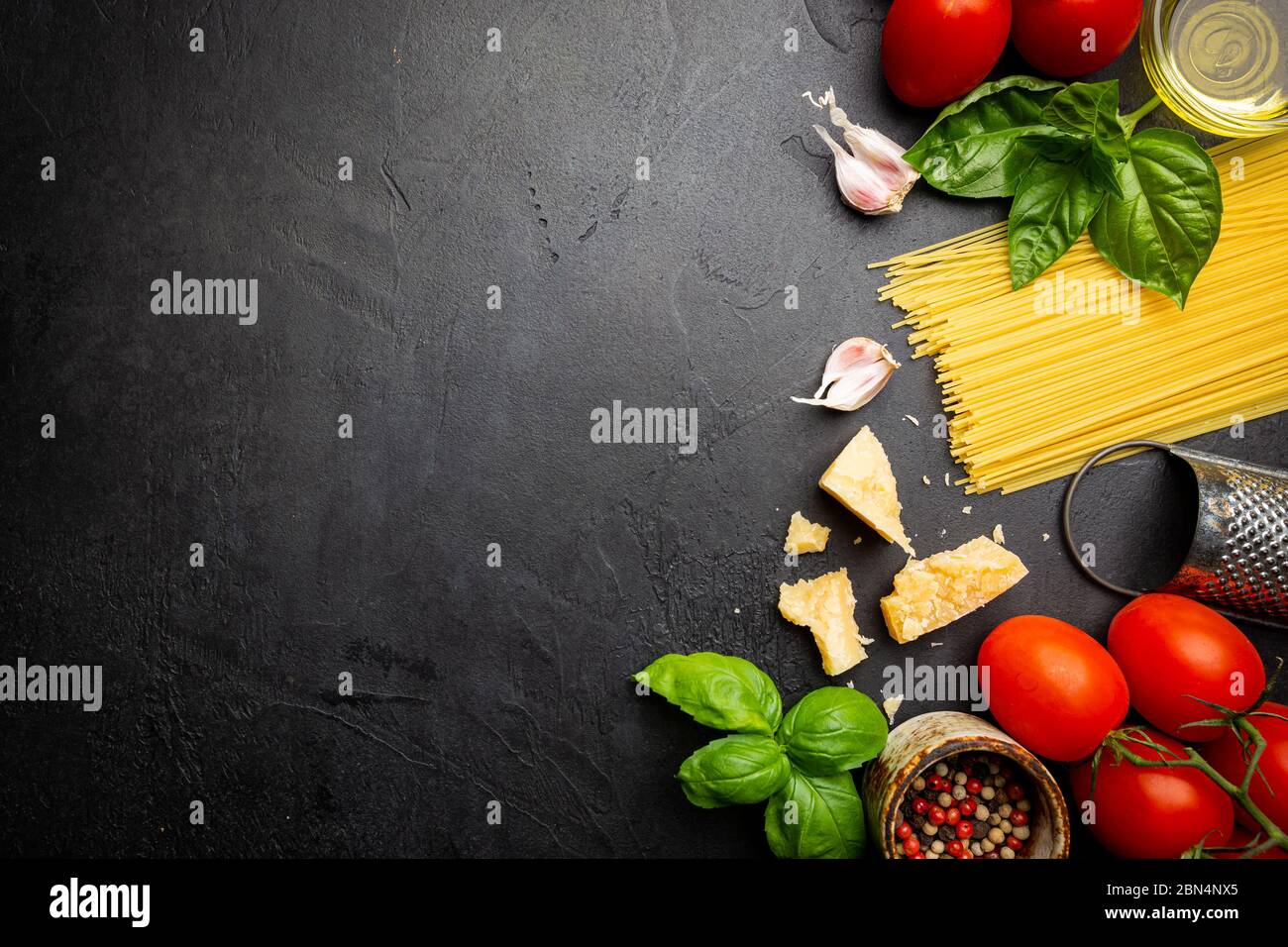 Pasta background. Several types of dry pasta with vegetables and herbs ...