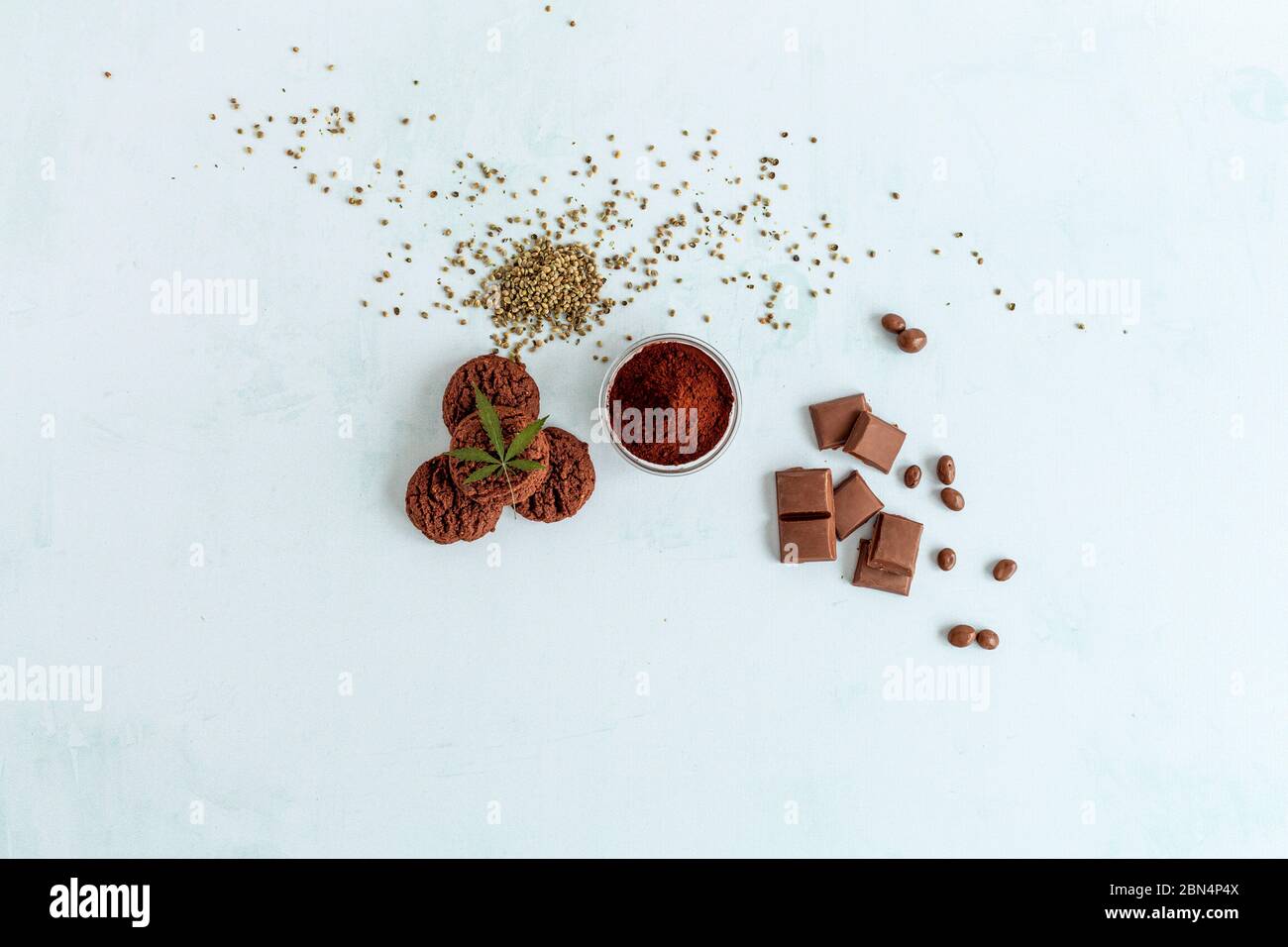 CBD cookies, cannabis chocolate, cocoa and hemp seed on bright ...