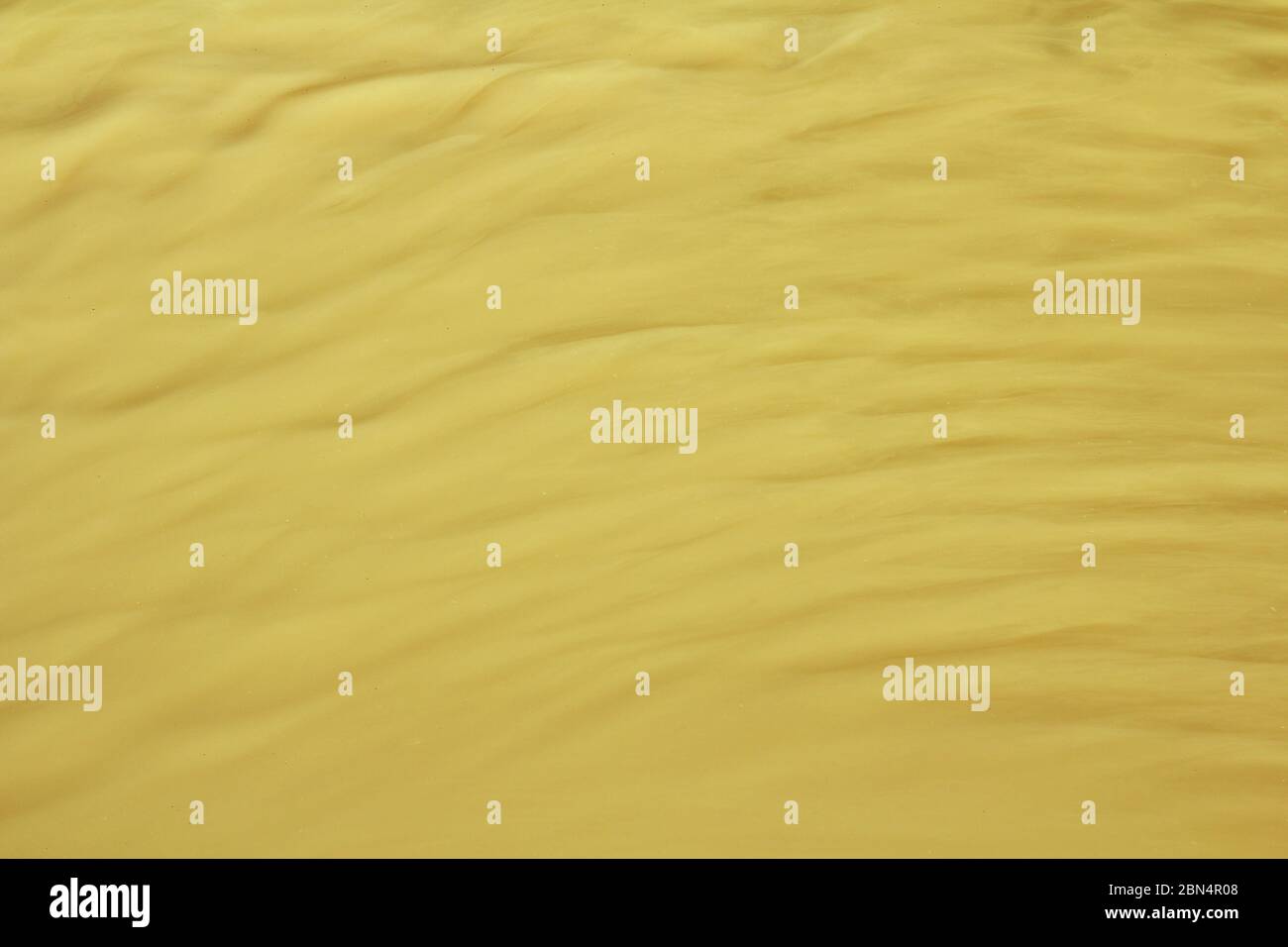 Yellow wavy striped background. Waves and ripples on the water. Place ...