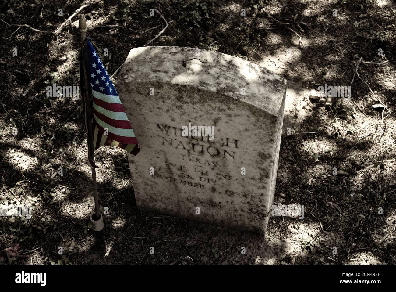 Old Headstone in Texas cemetery with American flag Stock Photo - Alamy