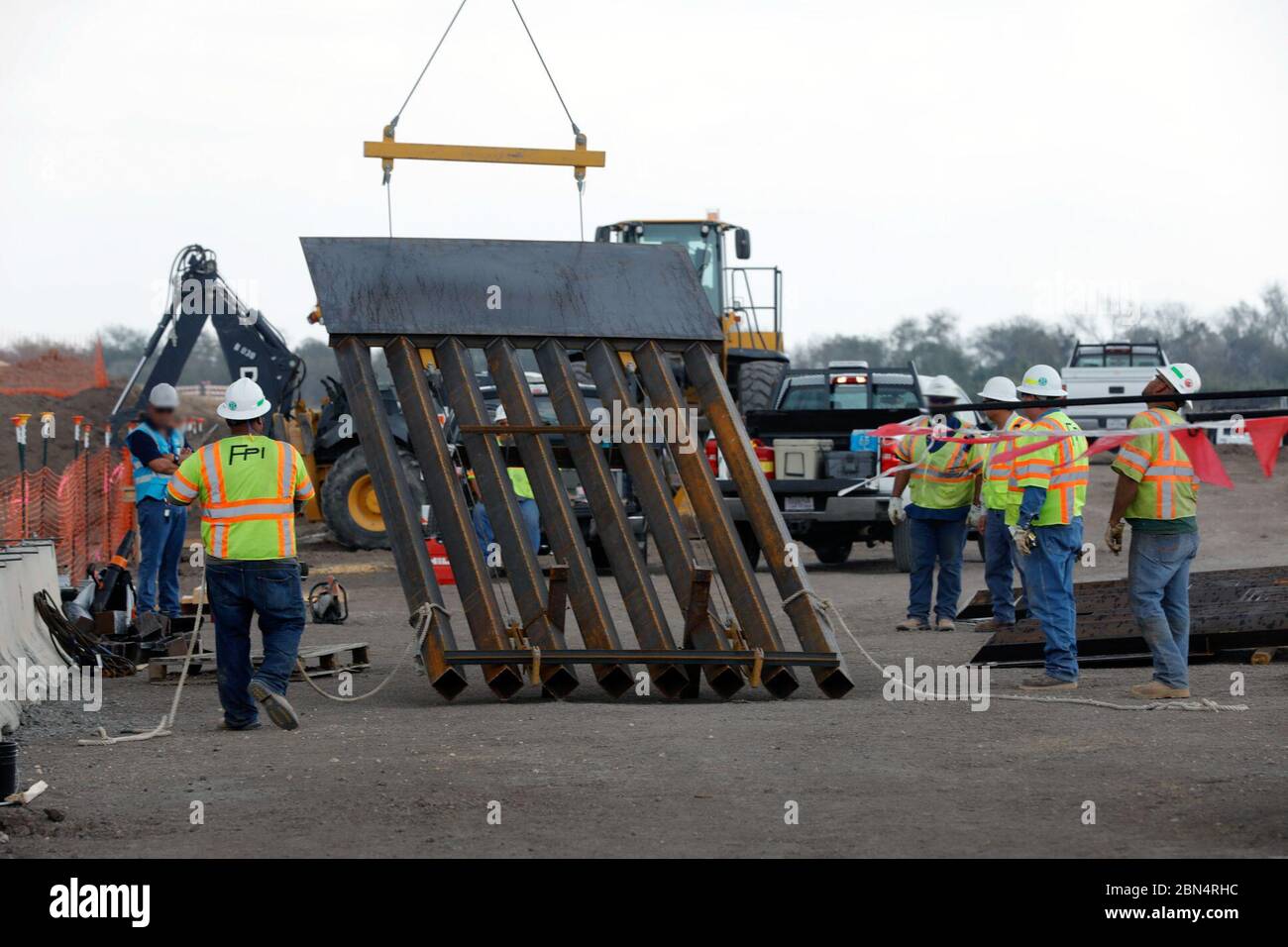 On October 30, 2019, construction workers installed border wall panels ...