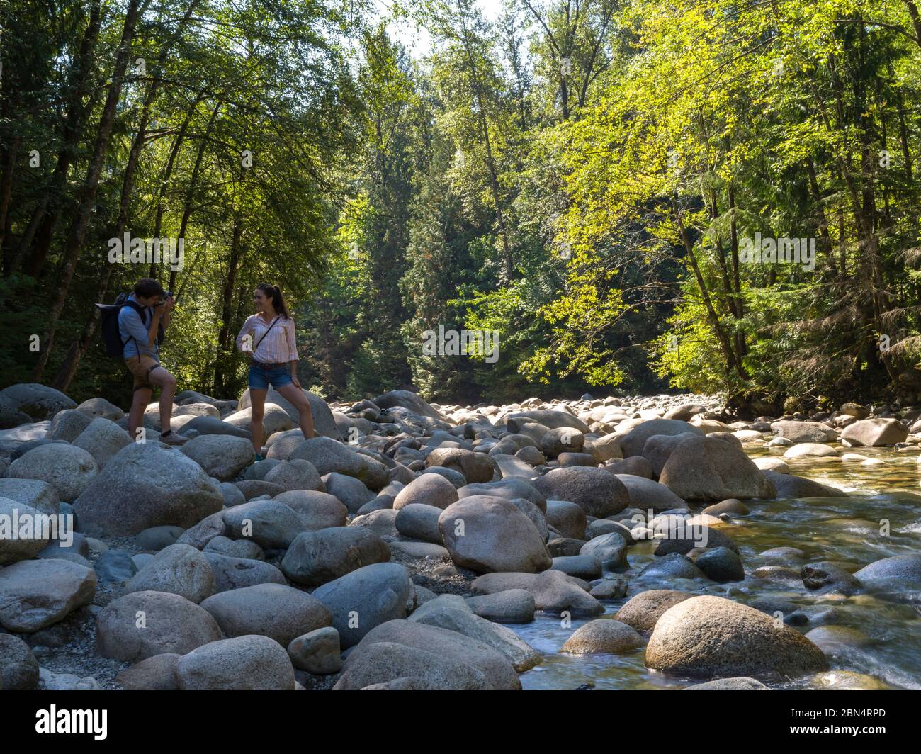 Couple standing on rocks, Lynn Canyon Park, Vancouver, Lower Mainland ...