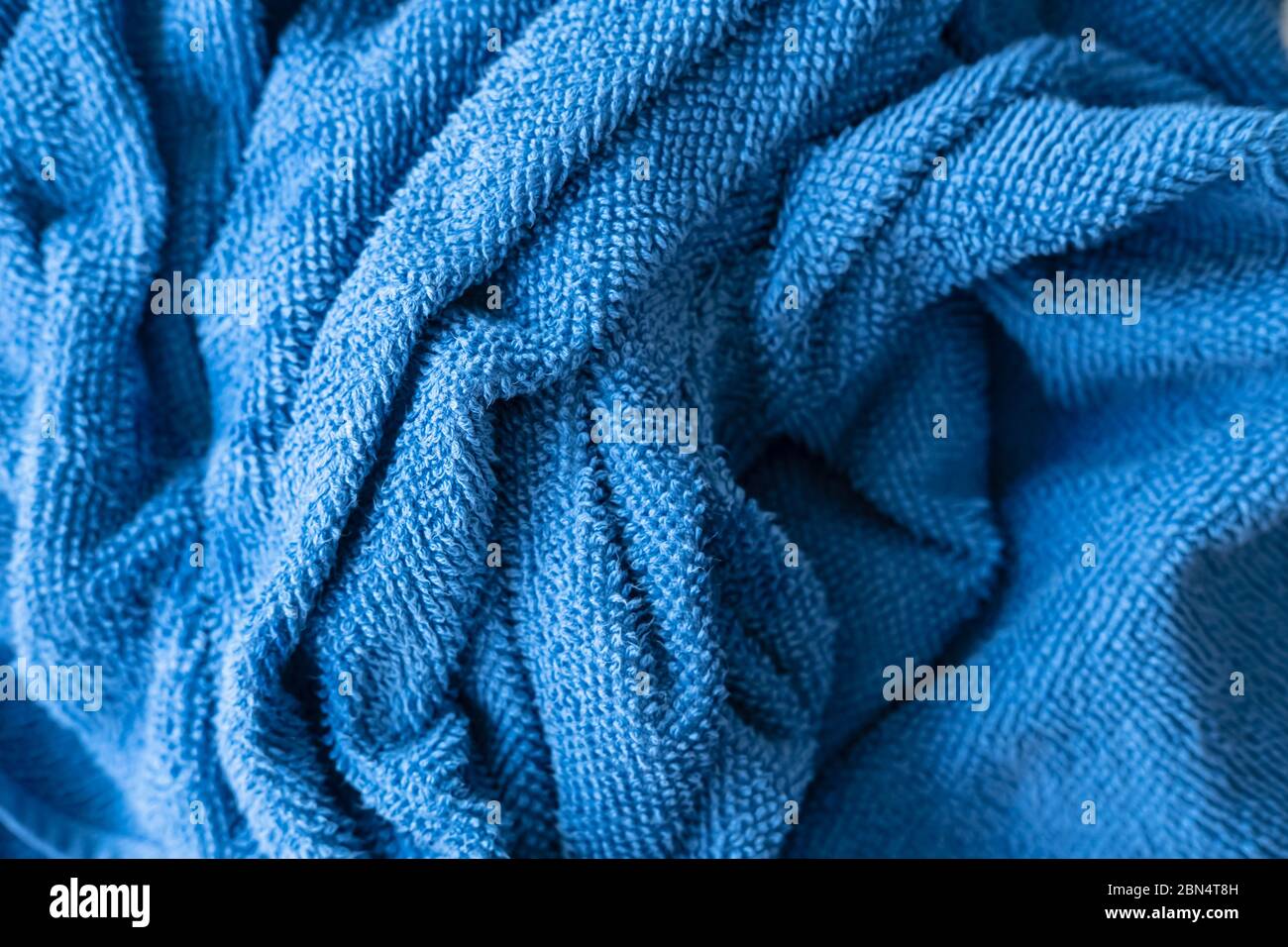 Crumpled terry, blue towel, top view. Background Stock Photo - Alamy