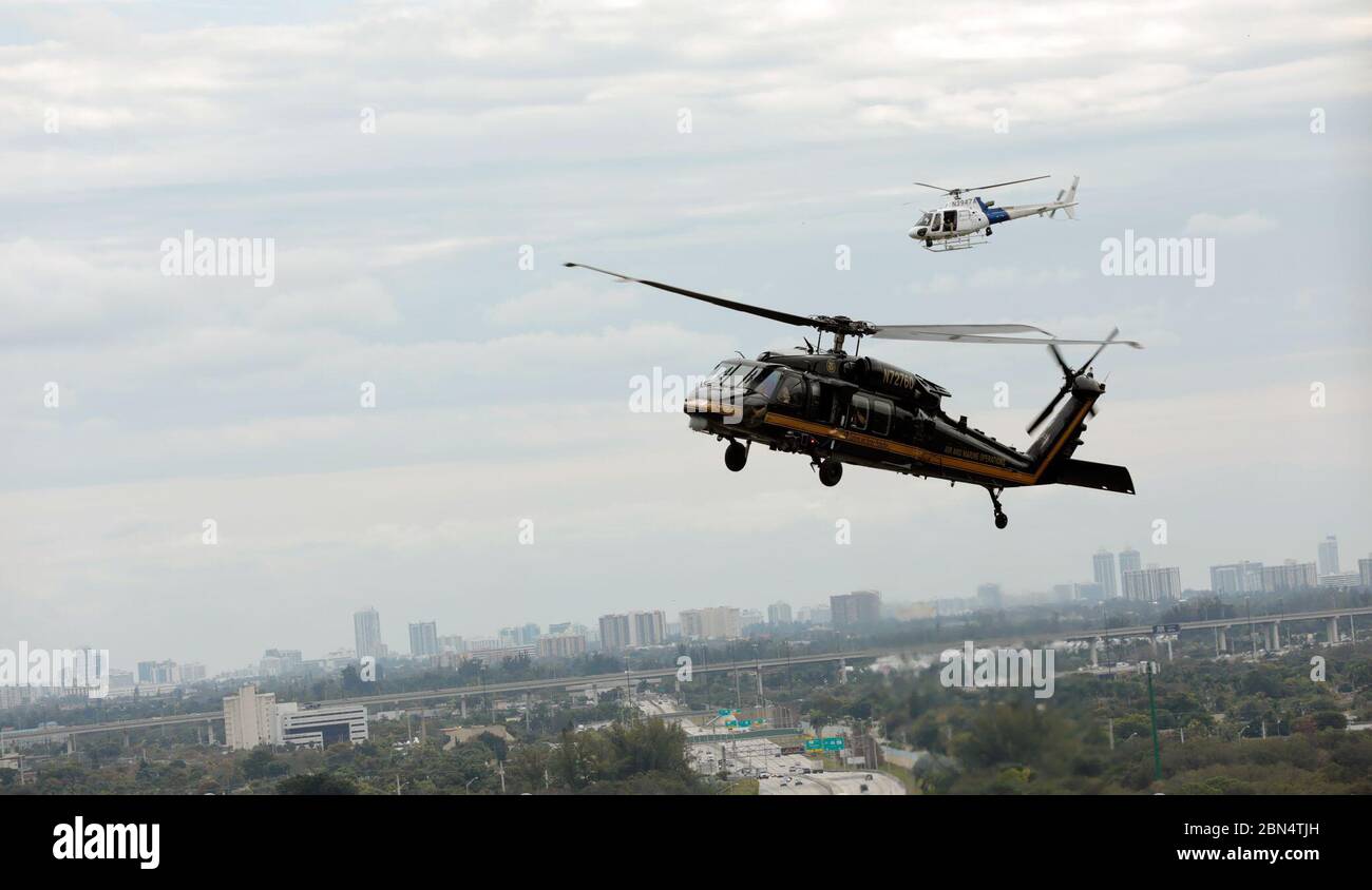 A UH-60 Black Hawk and an AS350 A-Star helicopter assigned to the U.S ...