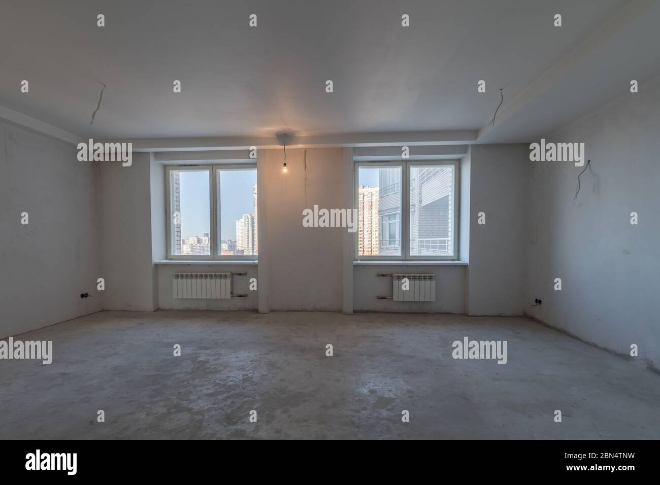 New Loft studio Interior in empty house. Two windows, concrete walls ...