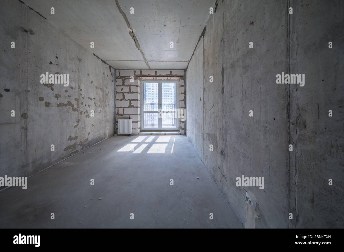 Unfinished modern building interior empty room ready for renovation and ...