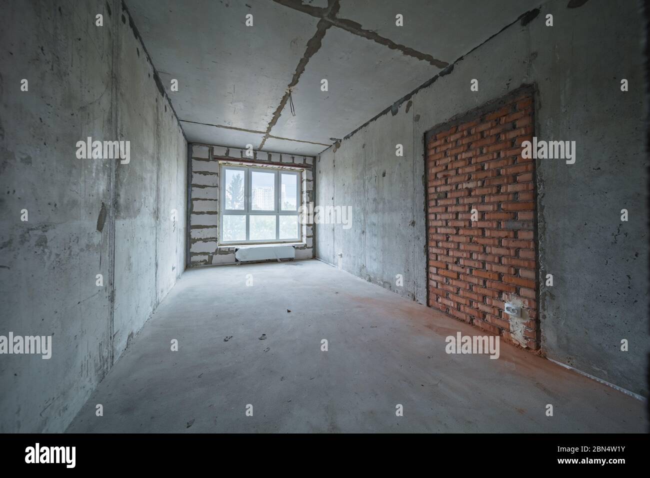 Unfinished modern building interior empty room ready for renovation and ...