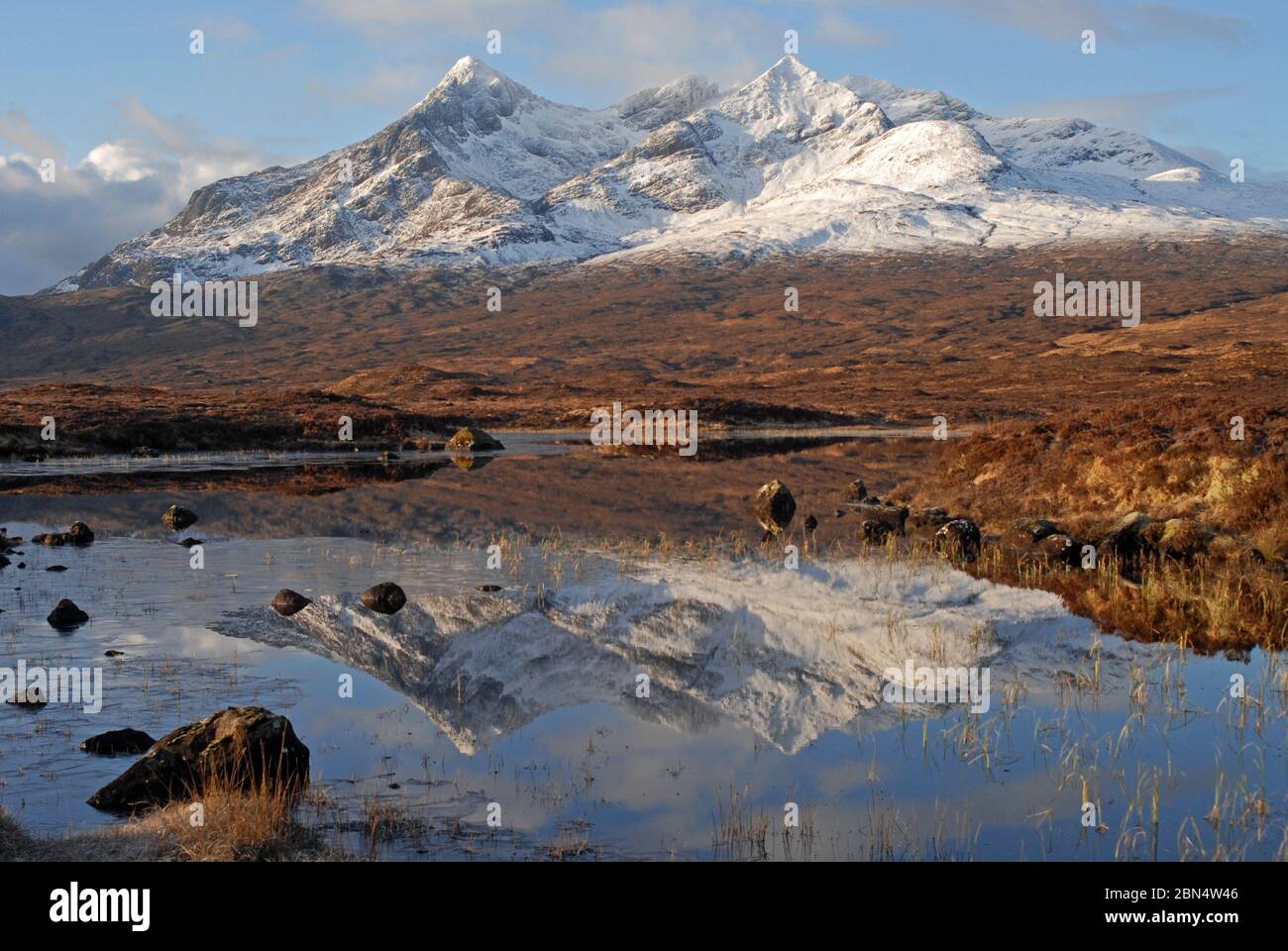 SGURR NAN GILLEAN and SGURR AM BASTEIN reflect in the still water of ...