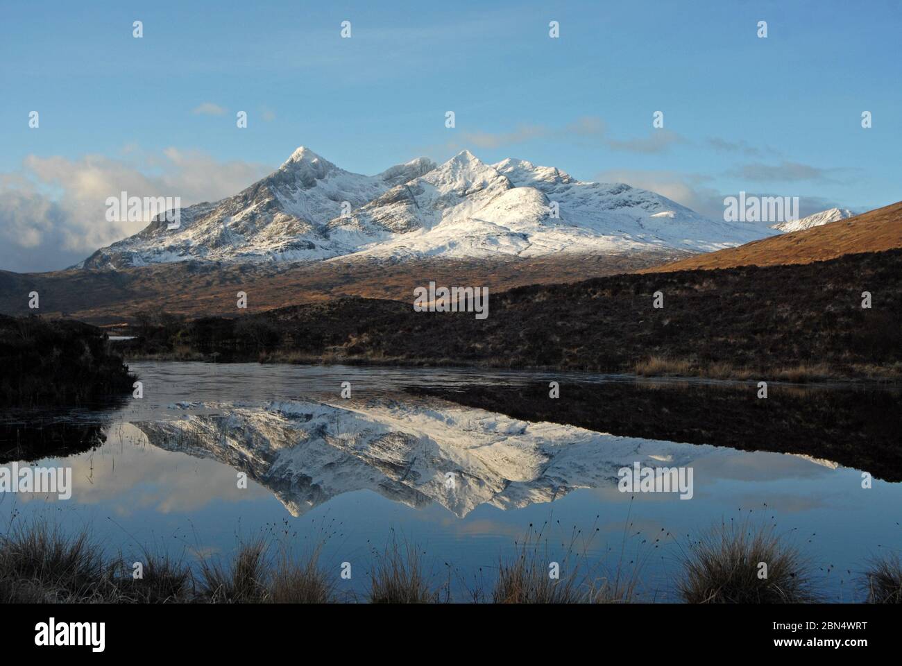 SGURR NAN GILLEAN and SGURR AM BASTEIN reflect in the still water of ...