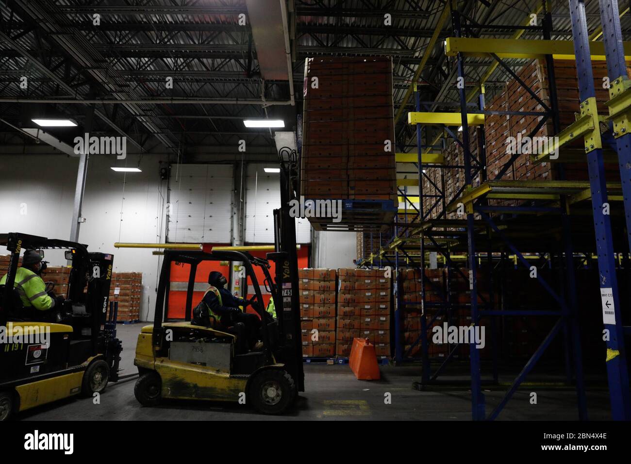 Forklift operators at Penn Terminals in Eddystone, Pennsylvania, load ...
