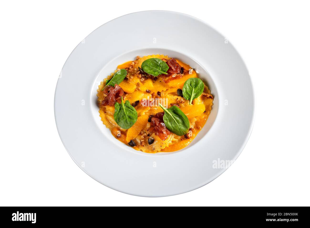 Italian dish, pasta ravioli with spinach and orange. On white ...