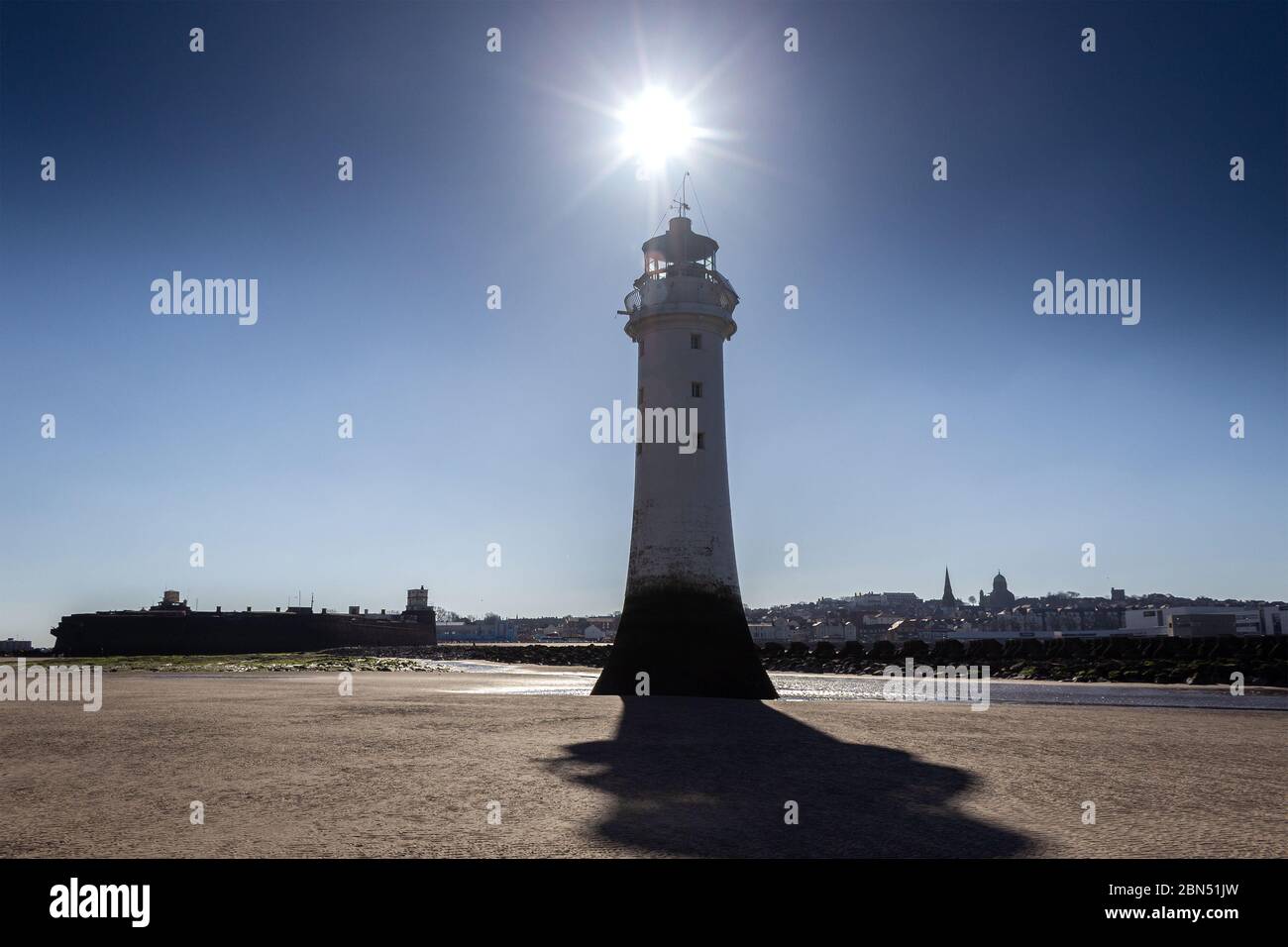 Sun rising above Perch Rock Lighthouse, New Brighton, Wirral Stock ...