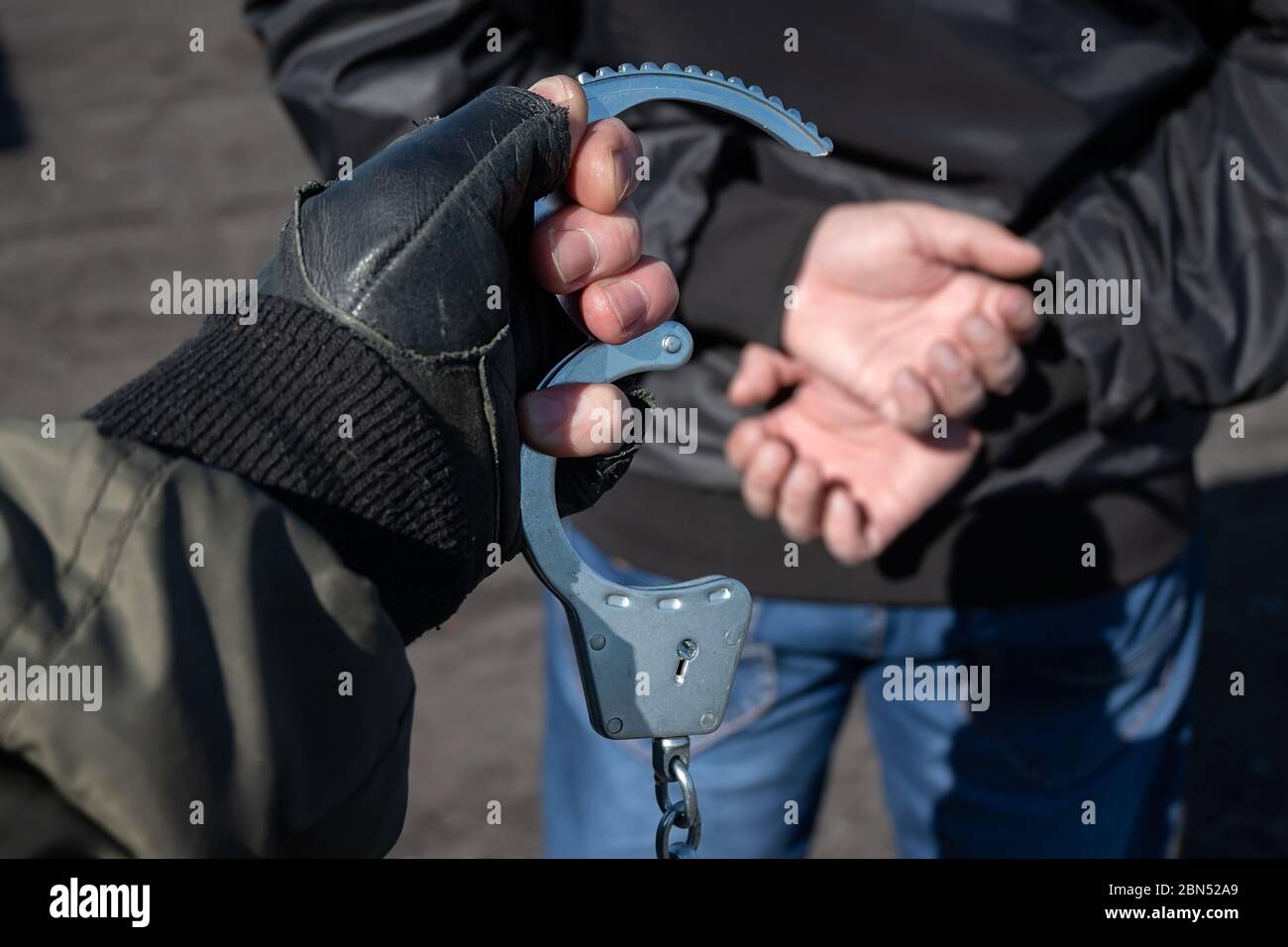 Police detained man handcuffs hi-res stock photography and images - Alamy