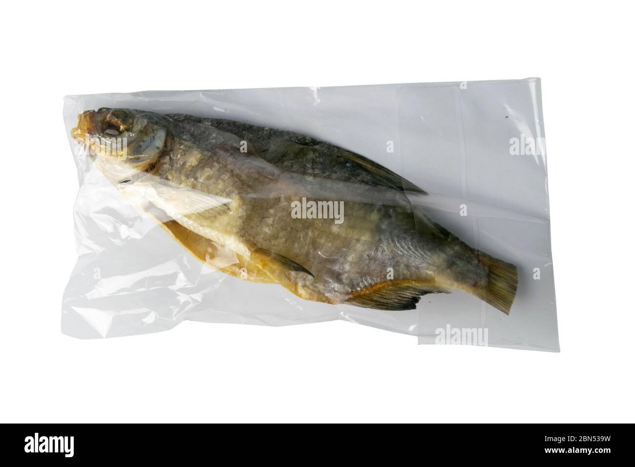 Dried bream in a transparent package on a white background. Snack Fish ...