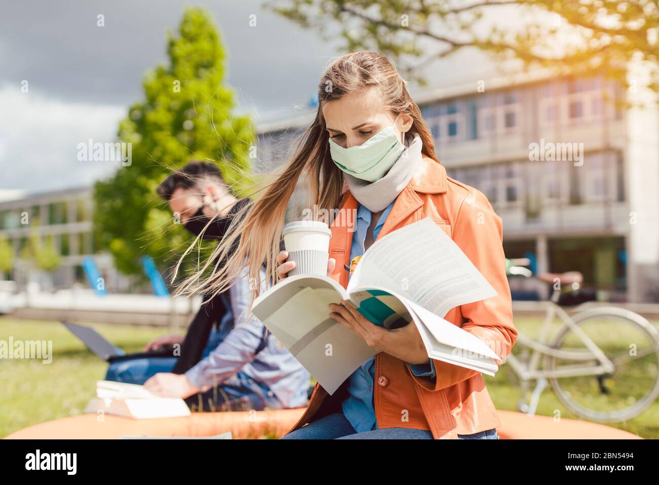 Woman student on college campus learning wearing face mask Stock Photo ...