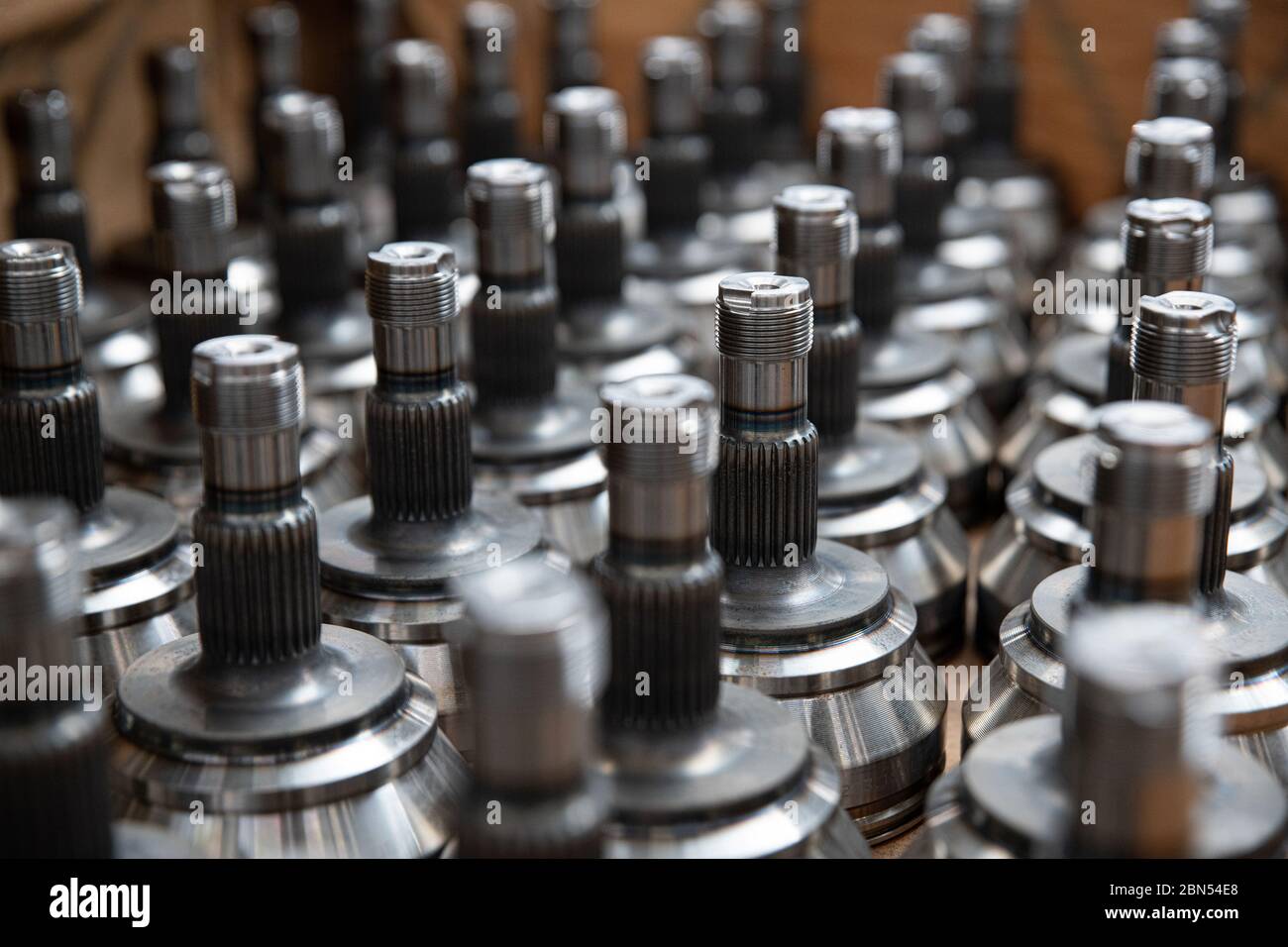 Machine parts. Axles on a factory stack Stock Photo - Alamy