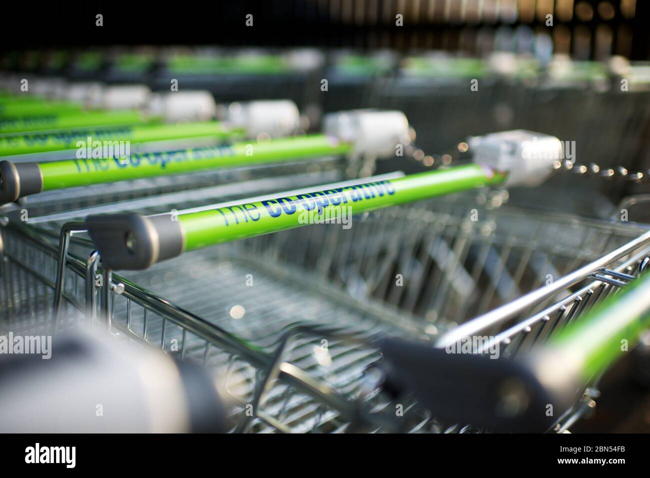 trollies in a row outside with the logo on the hand rail Stock Photo ...