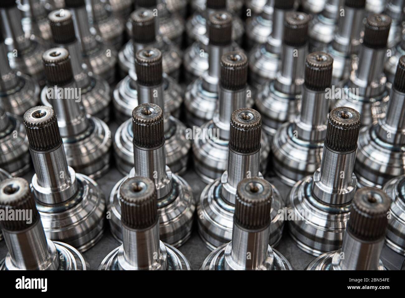 Machine parts. Axles on a factory stack Stock Photo - Alamy
