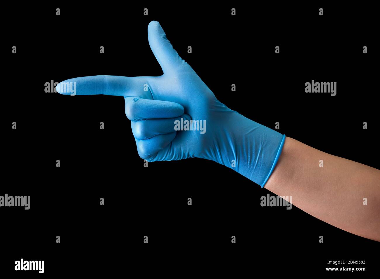 Doctor's hand in medical gloves pointing by finger on side isolated on ...