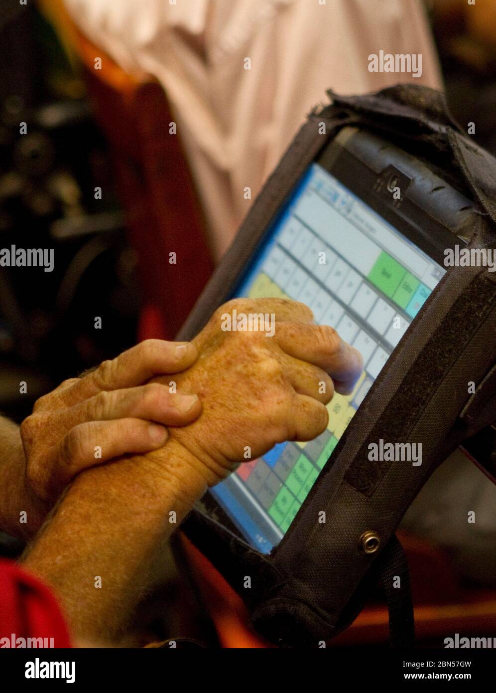 Physically disabled man uses touch screen hi-res stock photography and ...