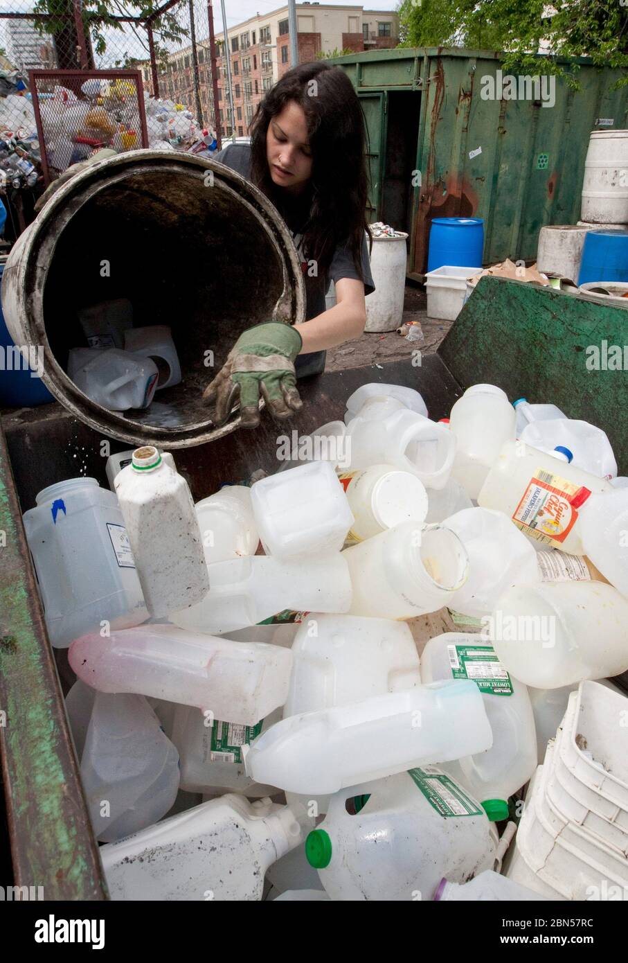 Austin, Texas USA, January 12 2012: Worker pours used plastic ...