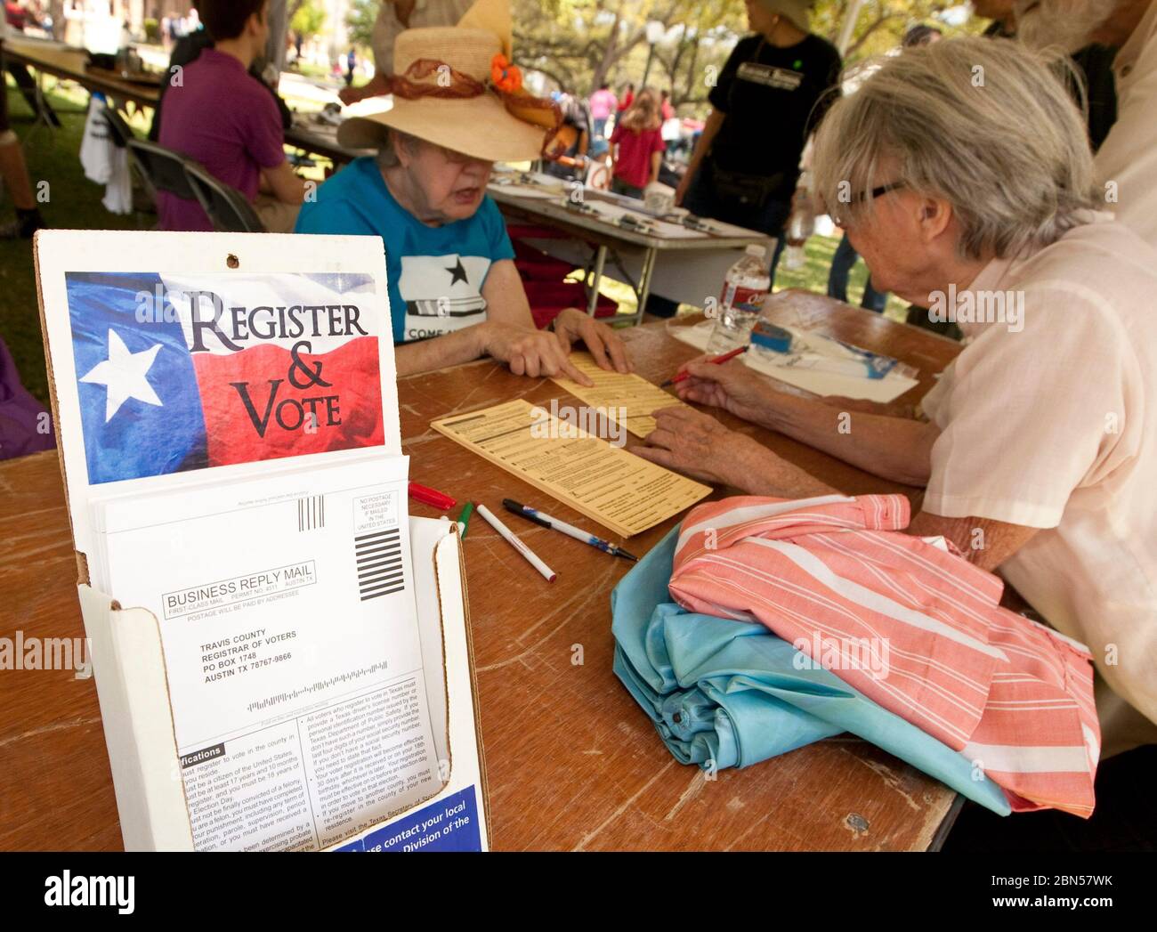 Austin Texas USA, 2012: Volunteer registrar helps elderly woman fill ...