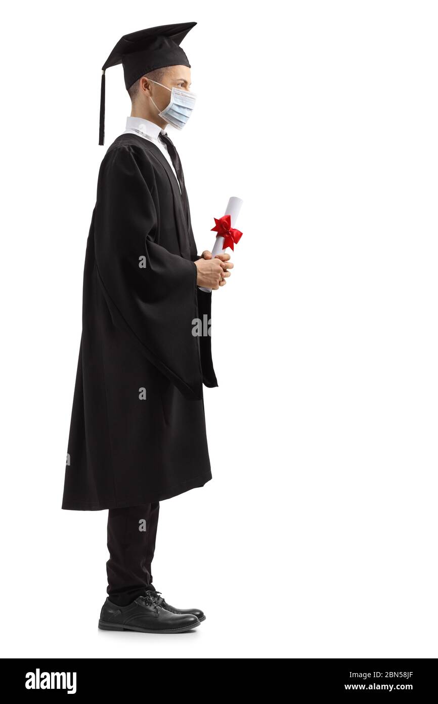 Full length profile shot of a male graduate with a protective face mask ...