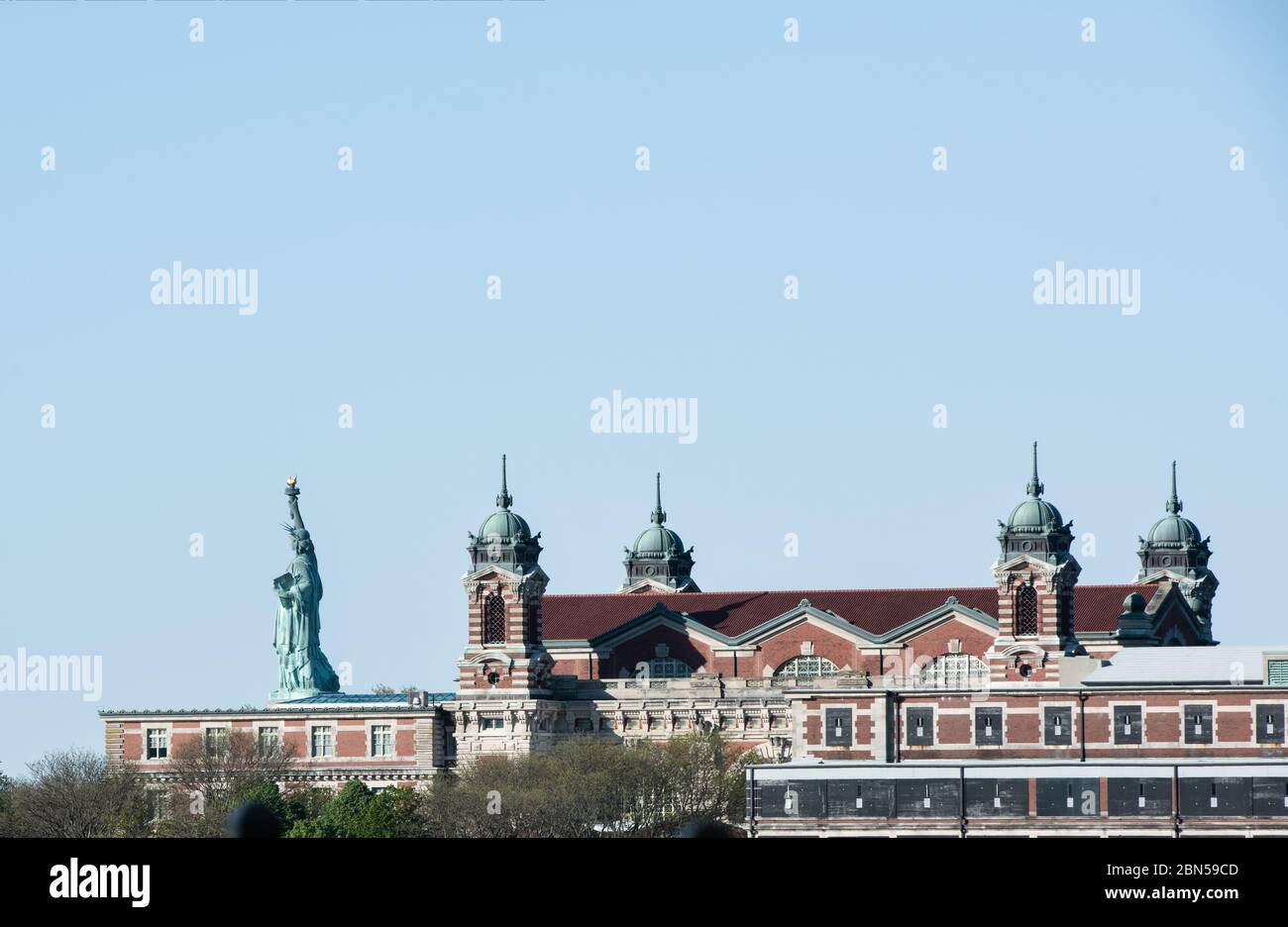 Statue of Liberty with Ellis Island in the background, taken from the ...