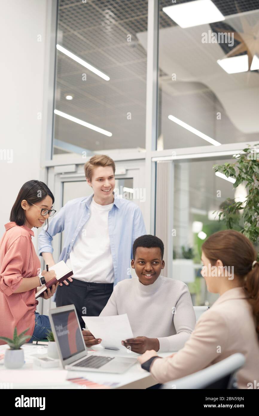 Group young people at work hi-res stock photography and images - Alamy