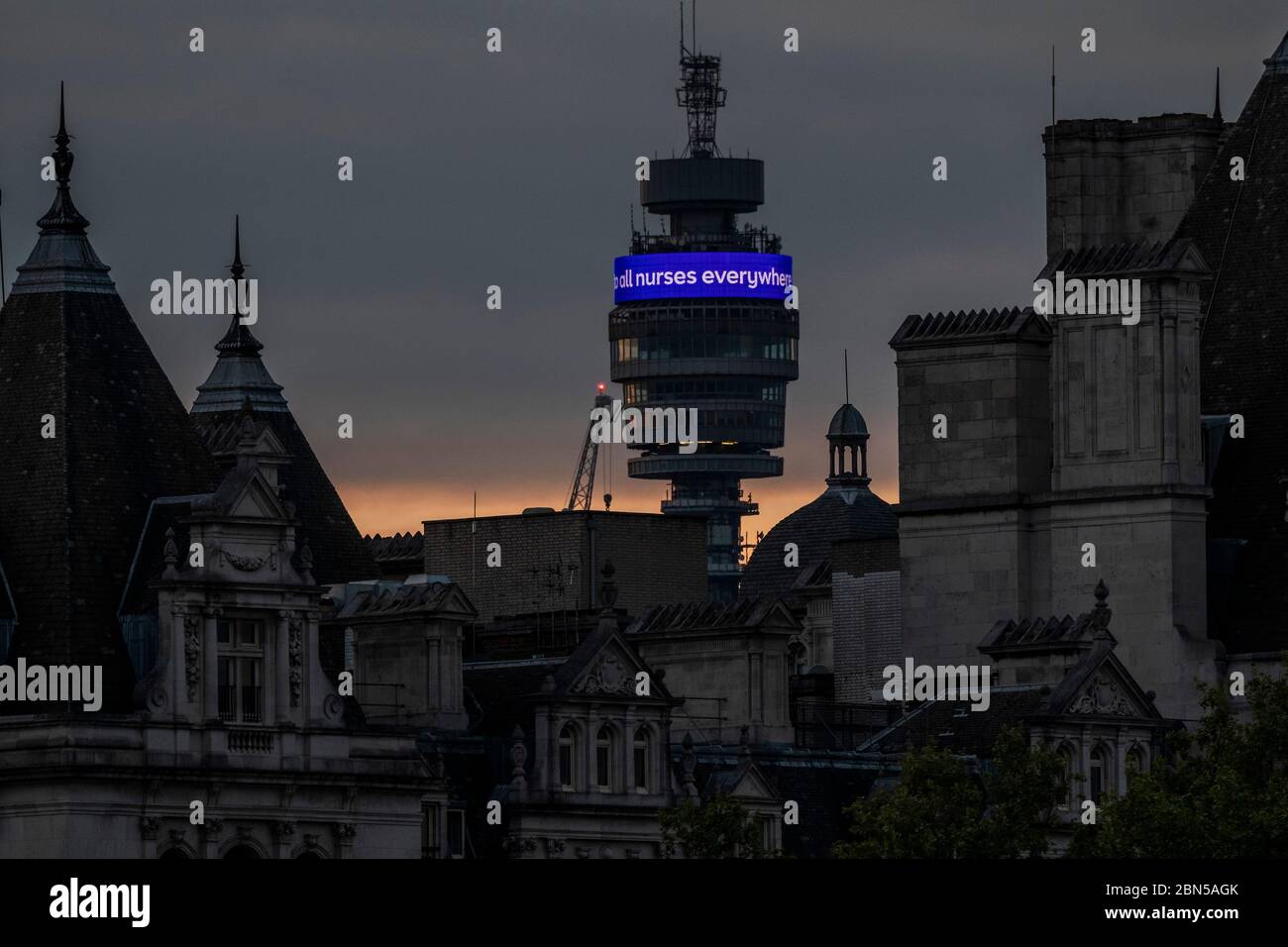 London, UK. 12th May, 2020. The BT tower displays messages about the ...